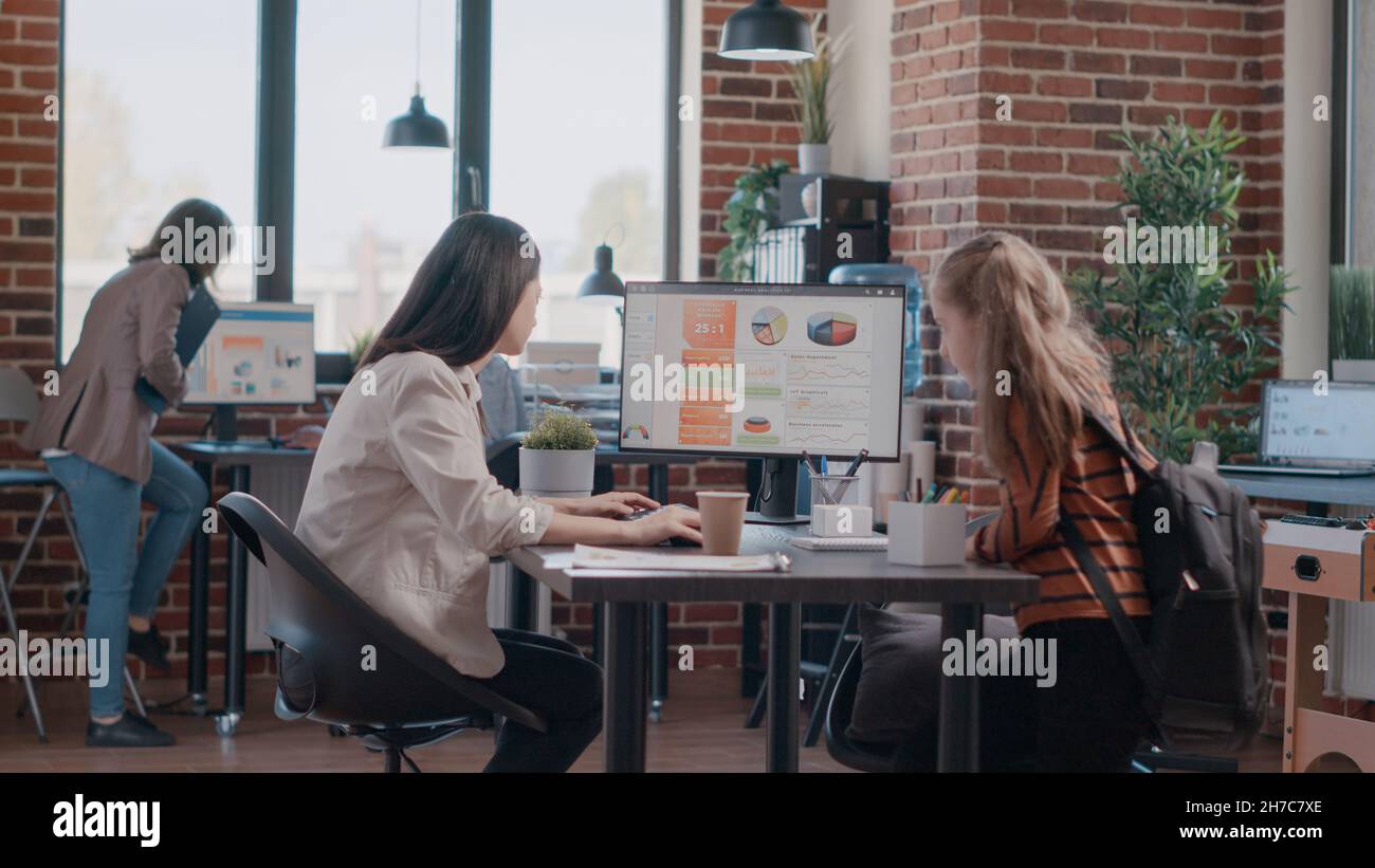 Little girl returning back from school to mother workplace, staying at ...