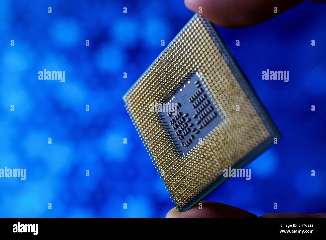 Computer chip in hands. A chipset is a set of electronic component that ...