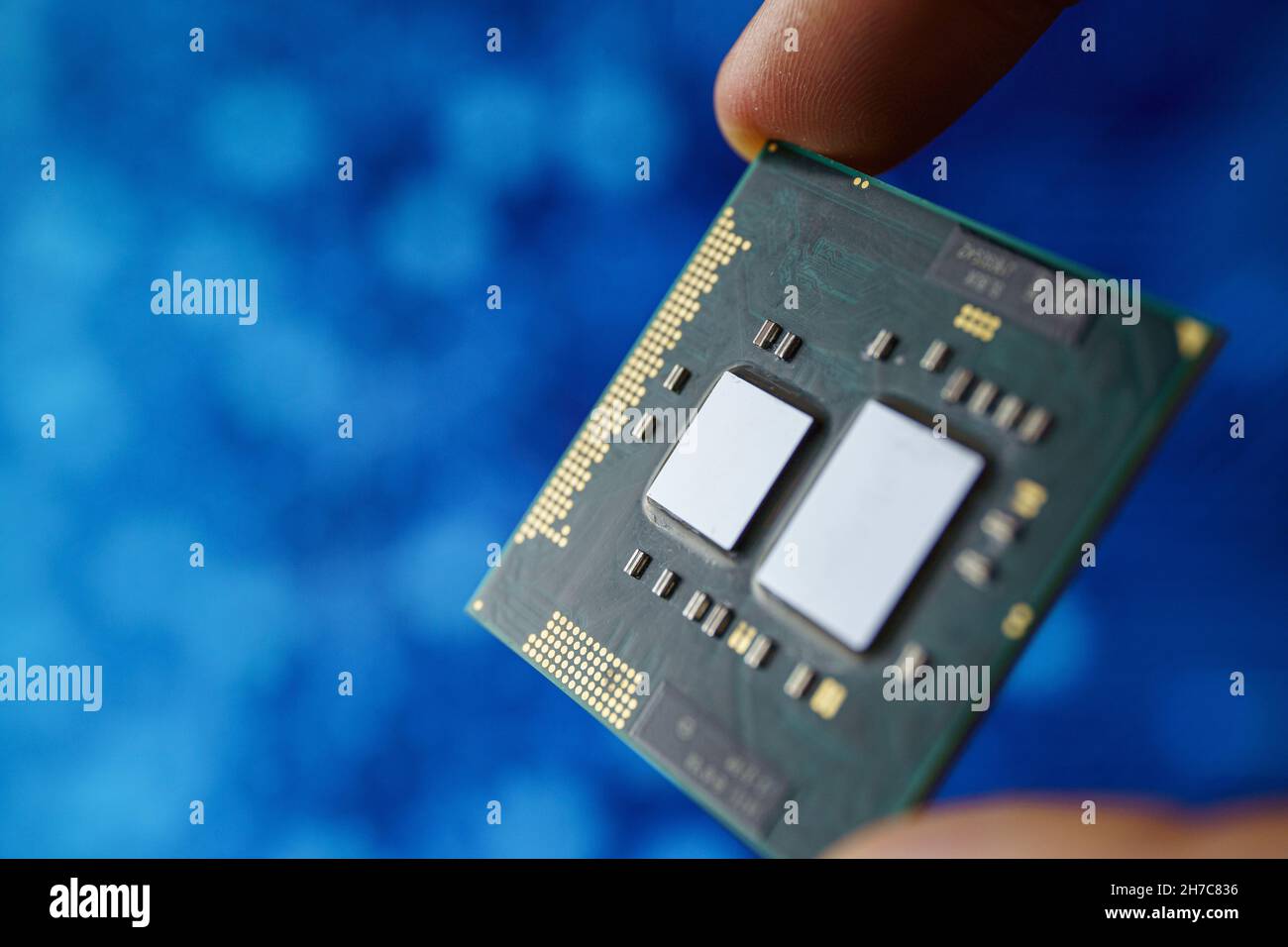 Computer chip in hands. A chipset is a set of electronic component that ...