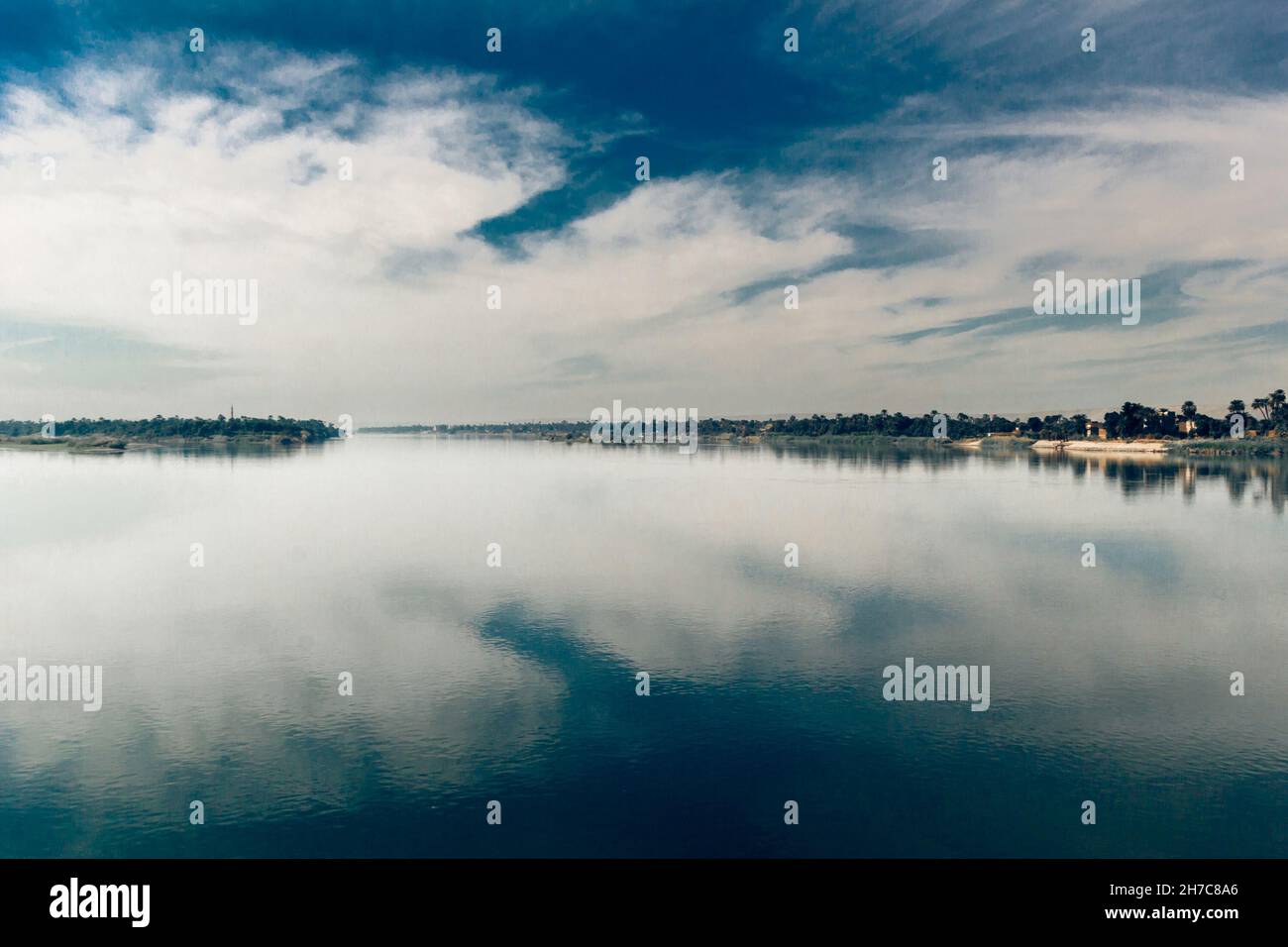 Beautiful scene of the blue cloudy sky reflecting in the Nile, Egypt ...
