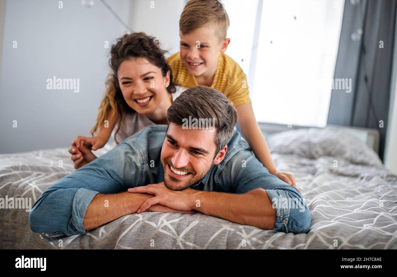 Young happy family having fun, playing together at home Stock Photo - Alamy