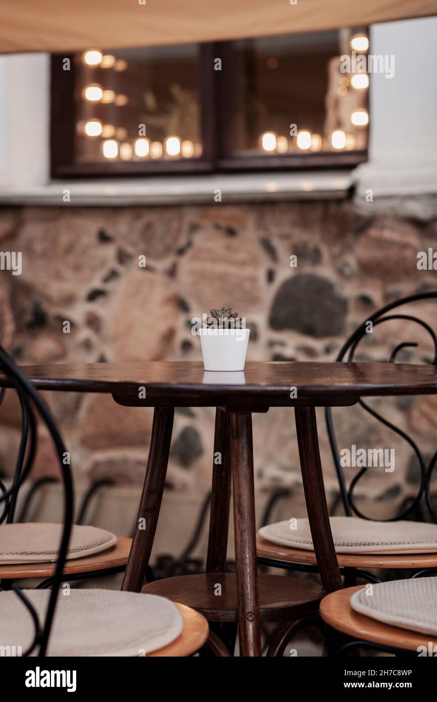 Street view of a coffee terrace with tables and chairs Stock Photo - Alamy