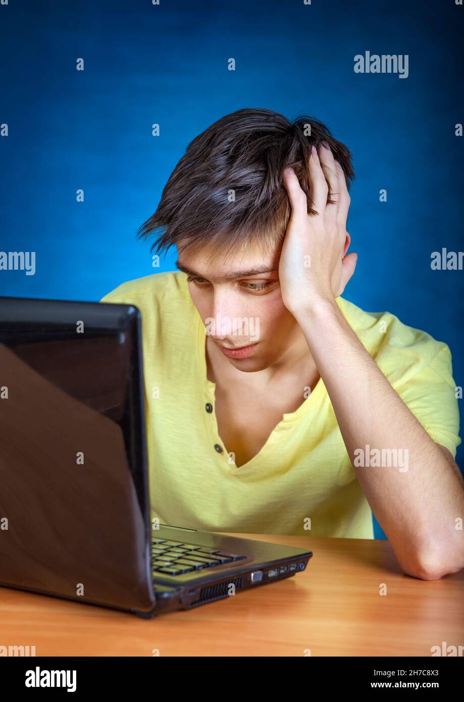Troubled Student with Laptop on the School Desk Stock Photo - Alamy