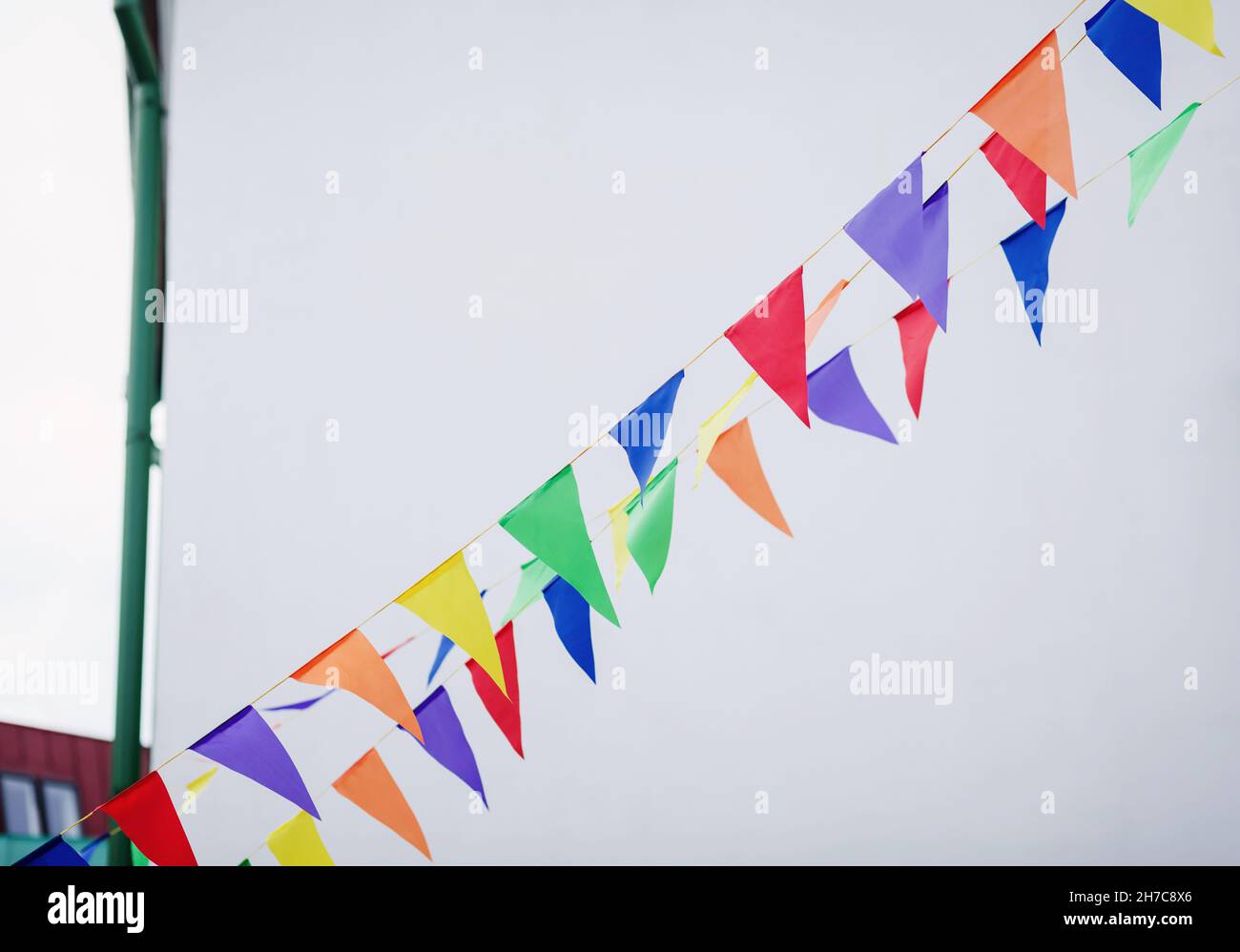 Multi colored triangular flags hanging in the sky at outdoor Stock ...