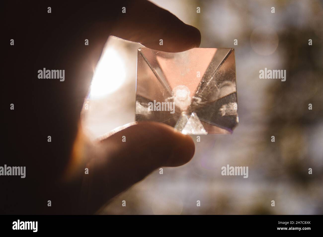 Hand holding crystal gemstone Stock Photo - Alamy