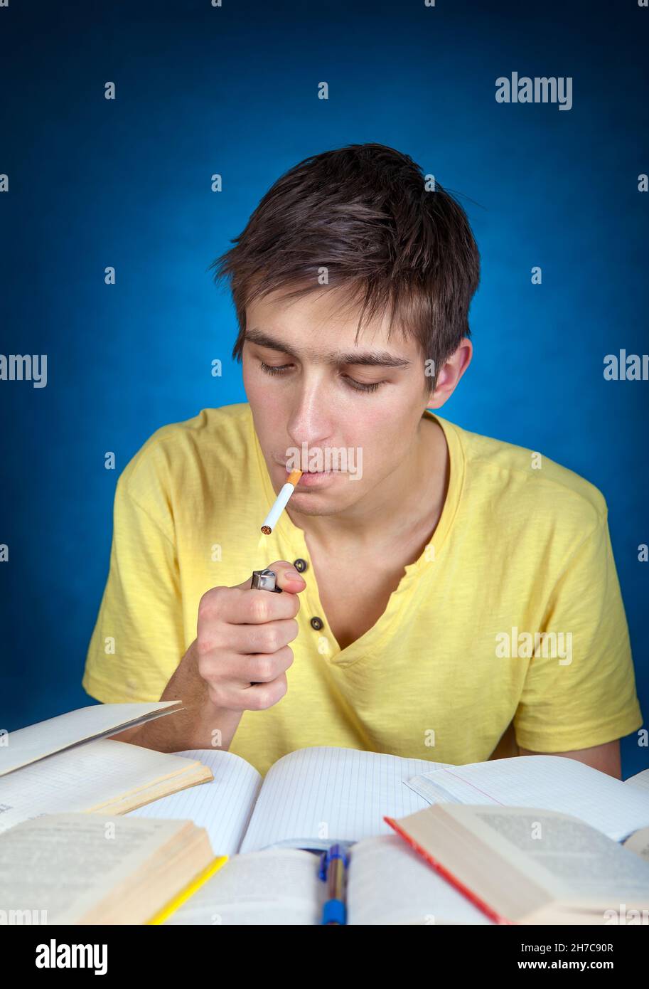 Student with Cigarette on the School Desk Stock Photo - Alamy