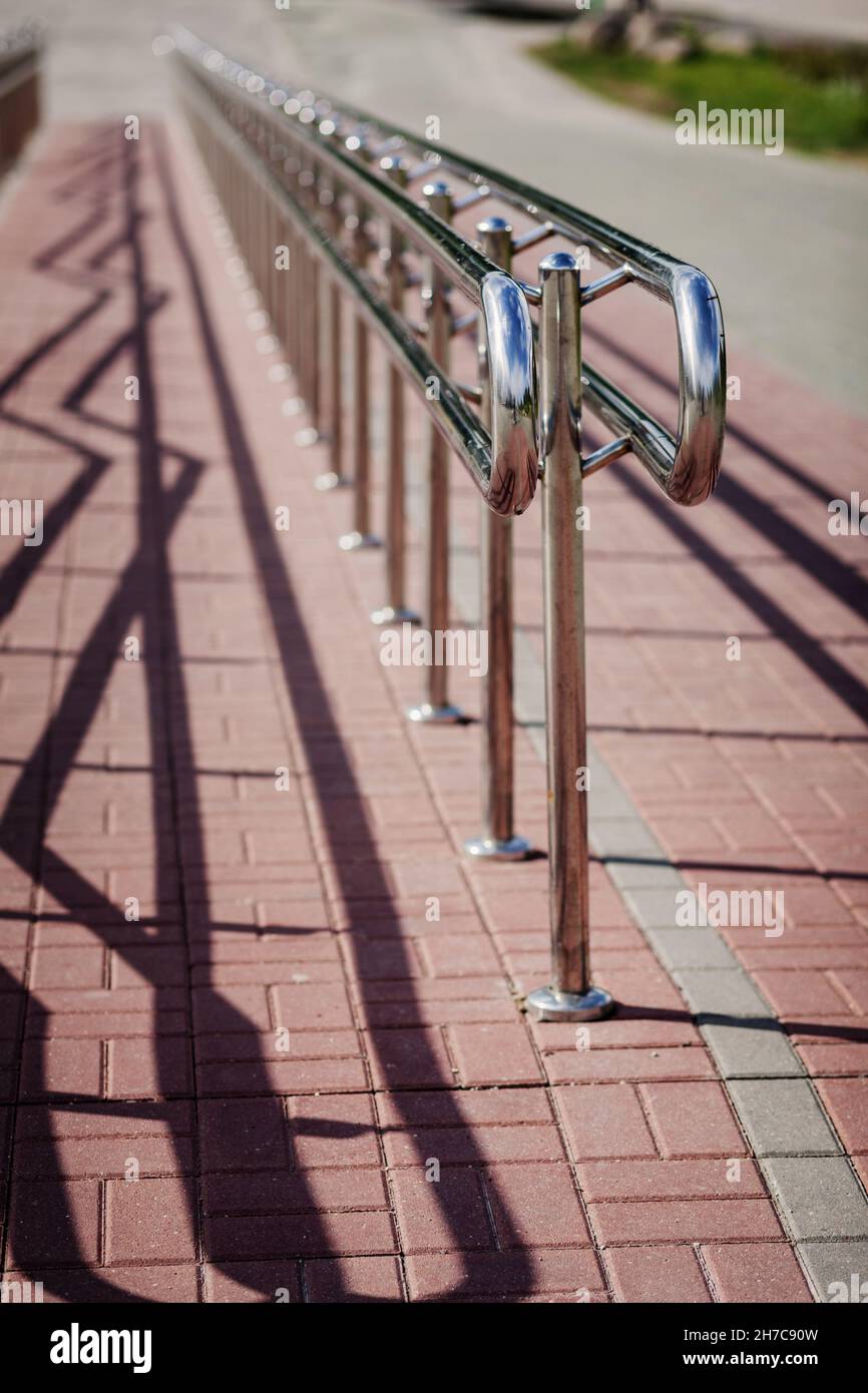 Stainless steel railing in city street. safe city Stock Photo - Alamy