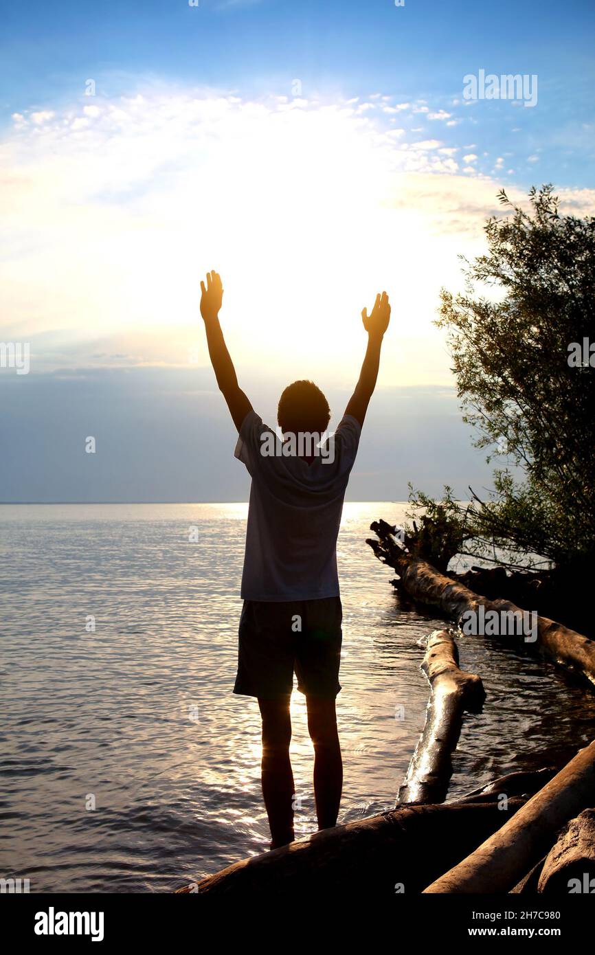 Happy Man Silhouette at the Sunset Nature Background Stock Photo - Alamy