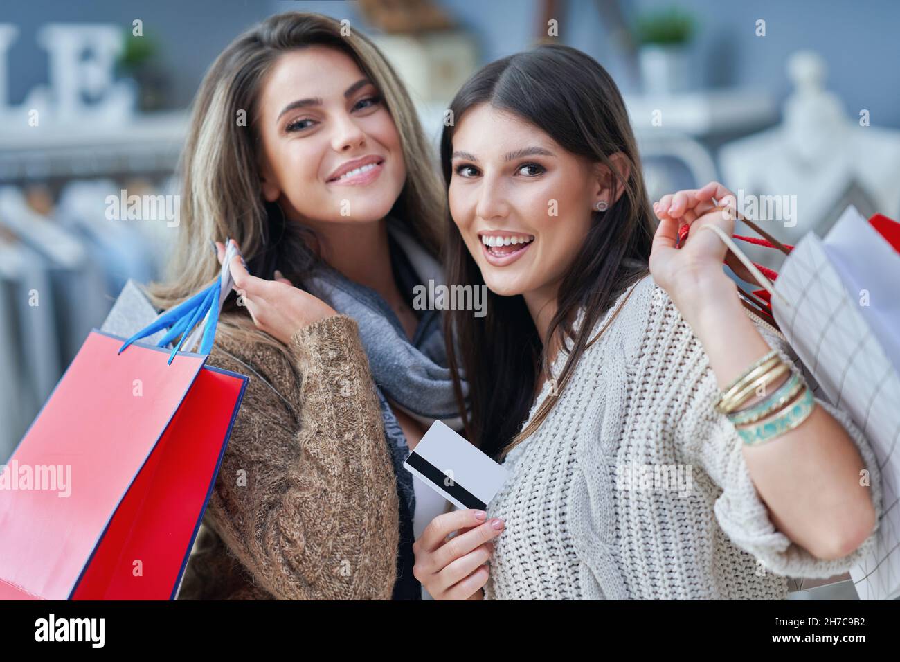 Group of happy friends during shopping Stock Photo - Alamy