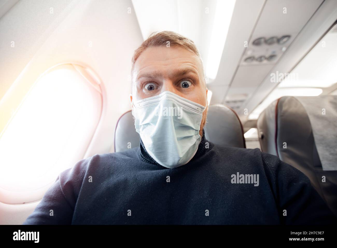 Afraid of fear flying on airplane and height tourist man in safe ...