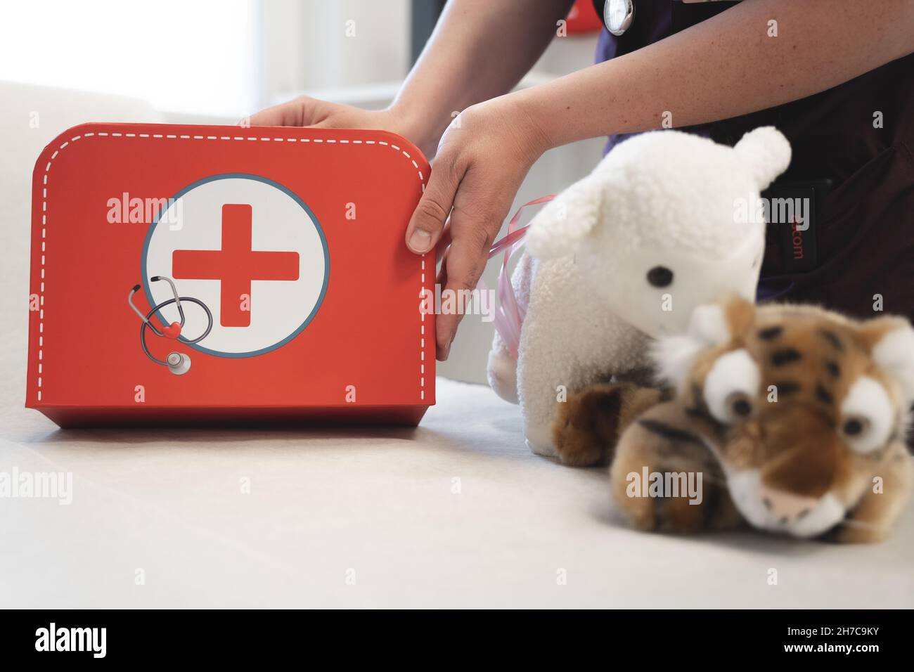 Red first medical aid box and puppies in the children hospital Stock ...