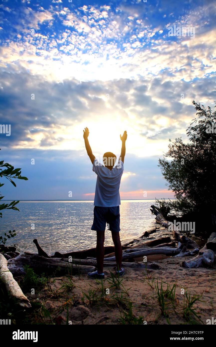 Happy Man Silhouette at the Sunset Nature Background Stock Photo - Alamy
