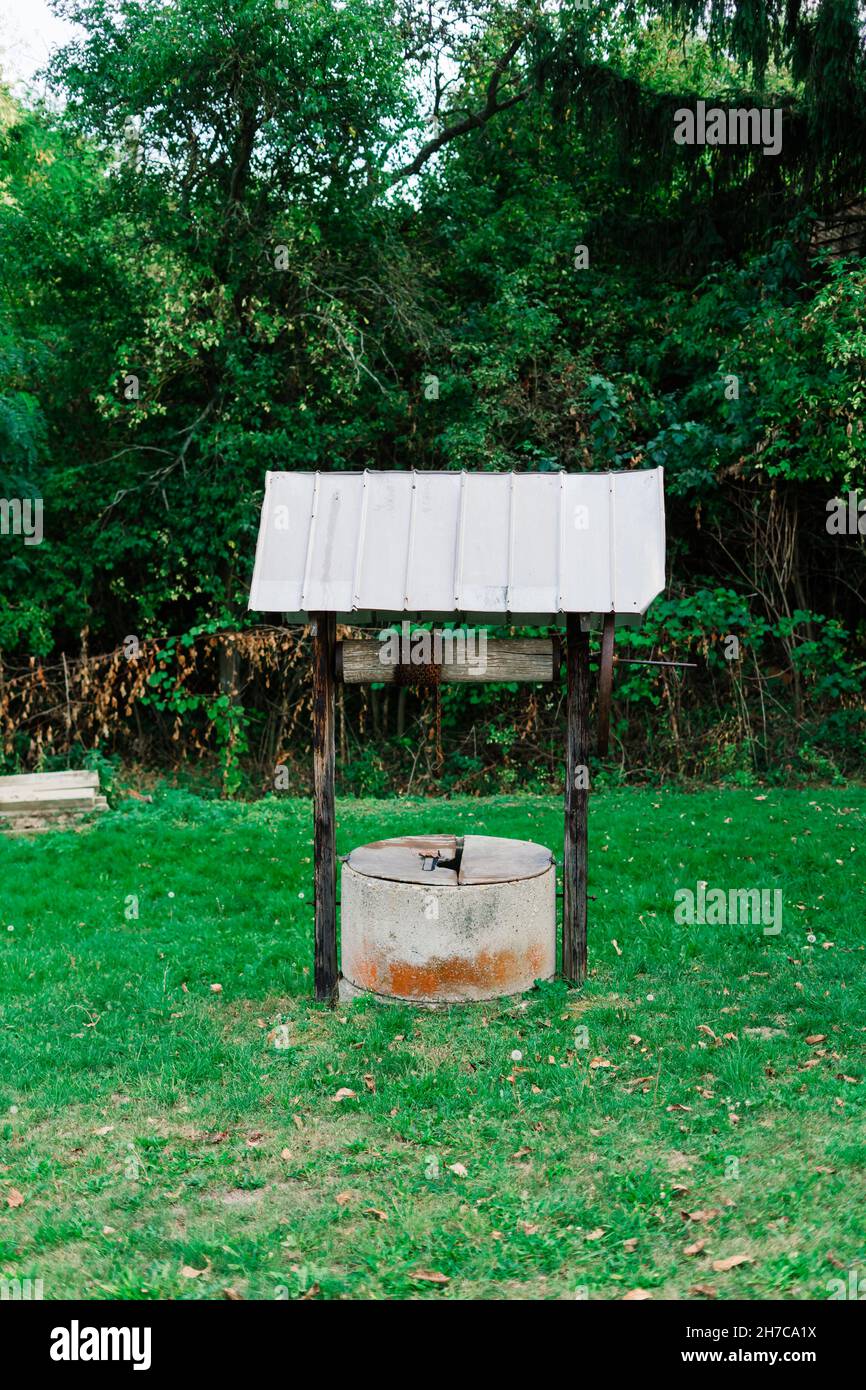 Old water well in a village, abandoned place Stock Photo - Alamy
