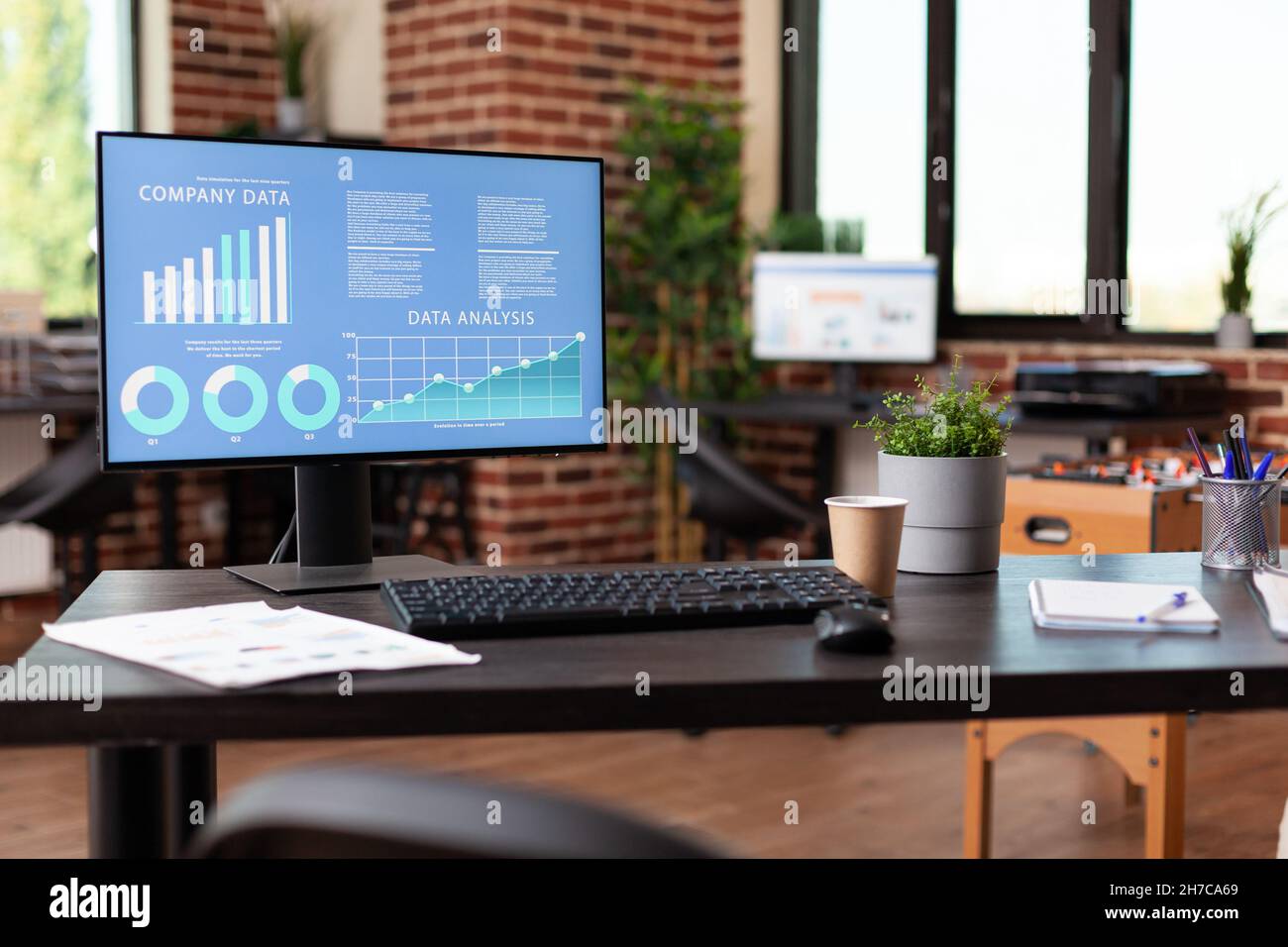 Computer showing charts with annual data analysis on display. Monitor ...