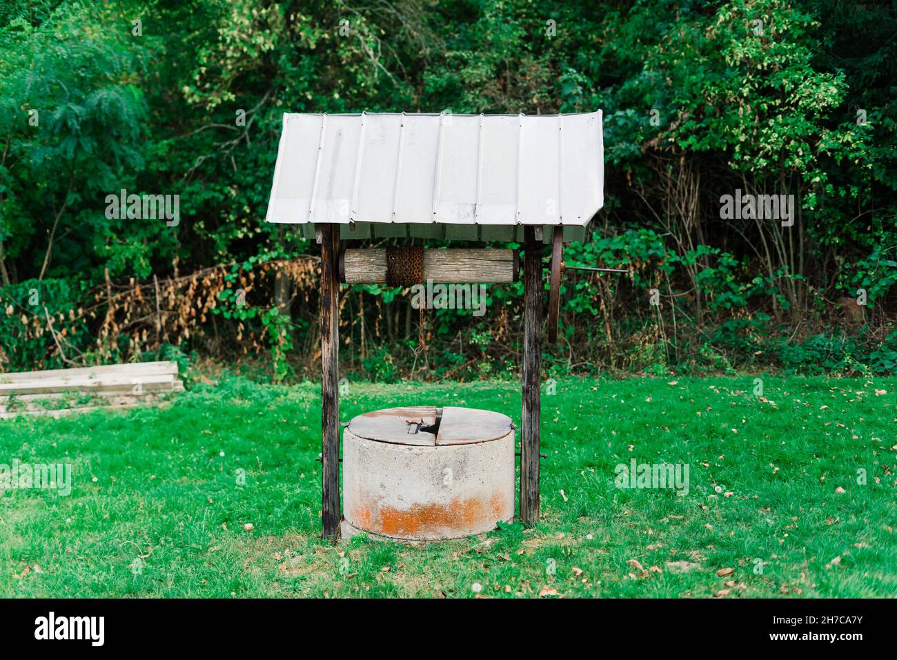 Old water well in a village, abandoned place Stock Photo - Alamy
