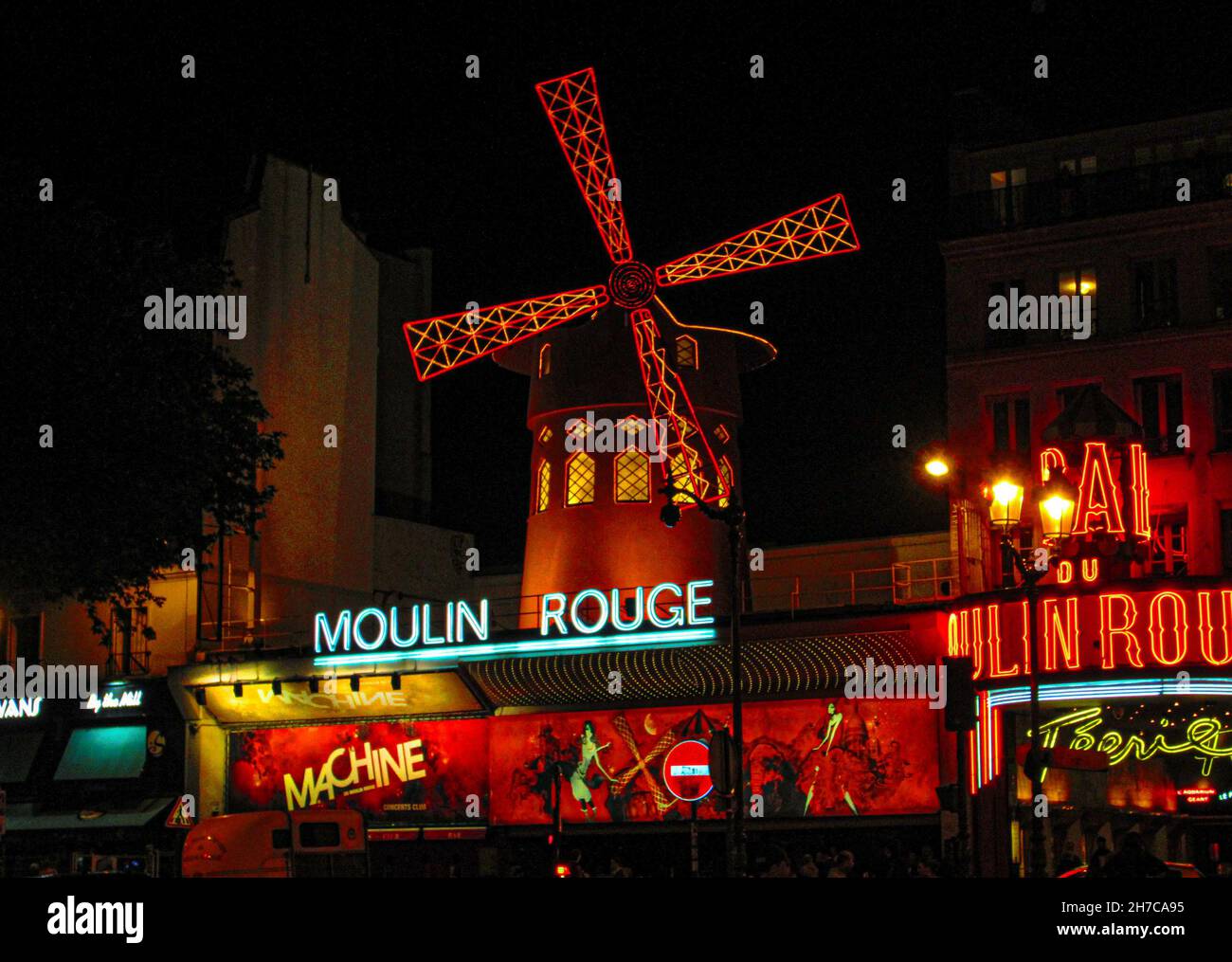 PARIS, FRANCE - Sep 13, 2021: A red windmill at moulin rouge at night ...