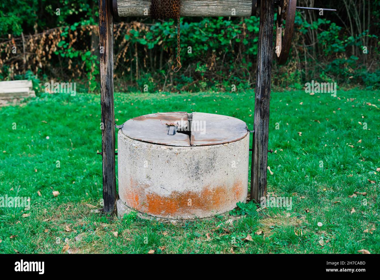 Old water well in a village, abandoned place Stock Photo - Alamy