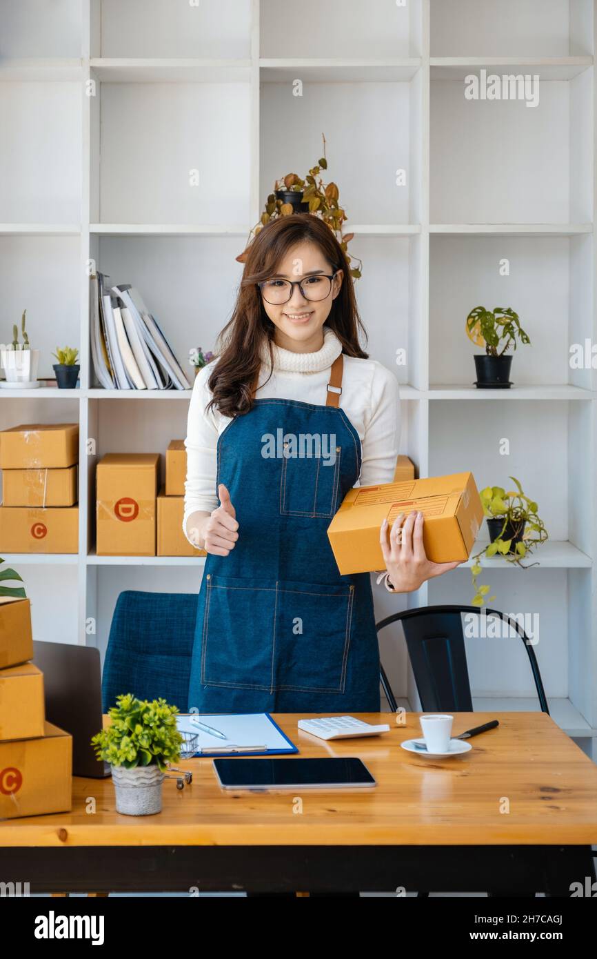 Woman picking up boxes hi-res stock photography and images - Alamy