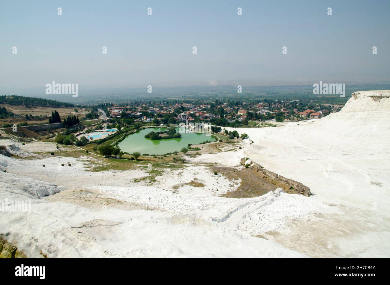 Beautiful white hills of Pamukkale, Turkey, under deep blue summer sky ...