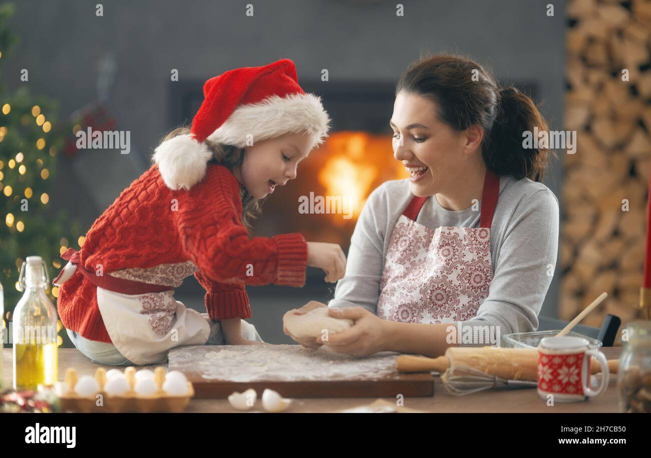 Merry Christmas and Happy Holidays. Family preparation holiday food ...