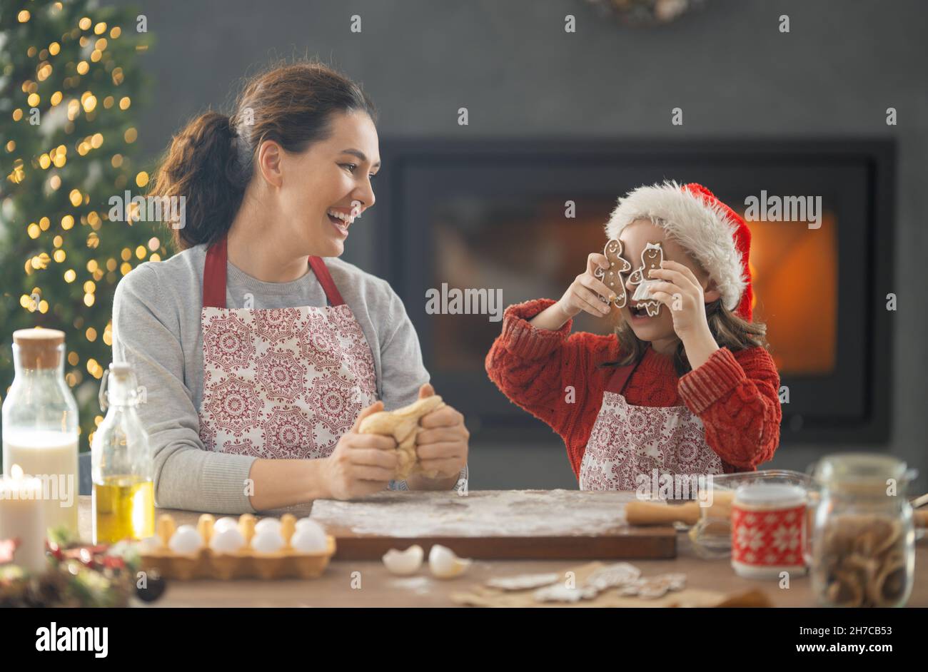 Merry Christmas and Happy Holidays. Family preparation holiday food ...