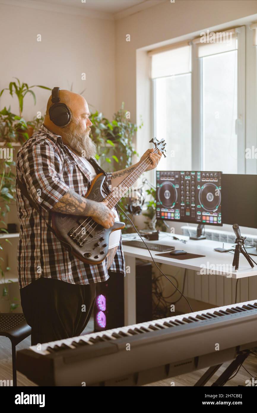 Male guitarist recording song home hi-res stock photography and images ...