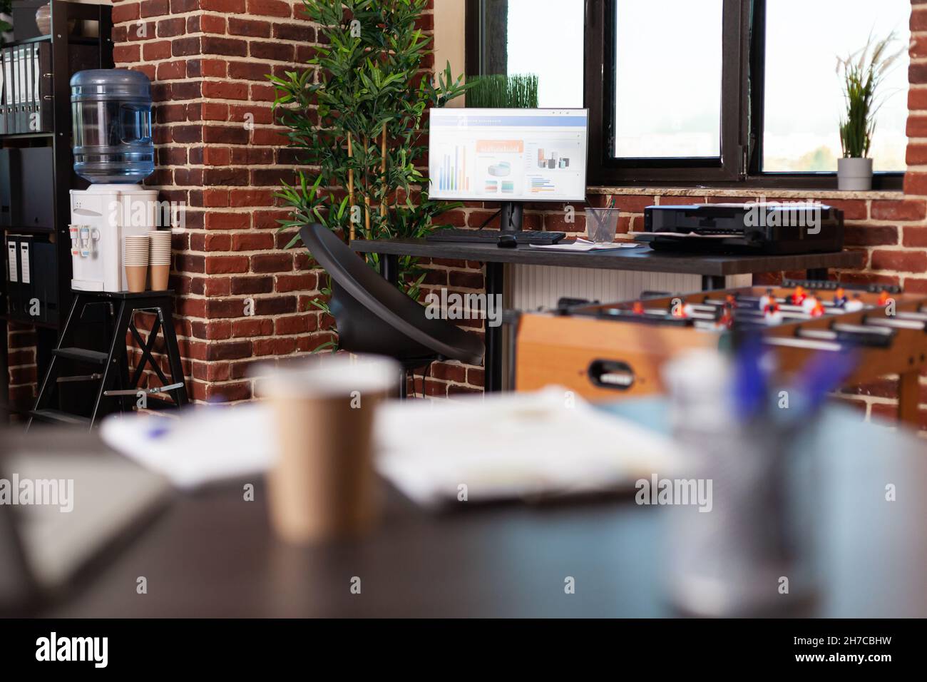Close up of monitor and work instruments on wooden desk in empty ...