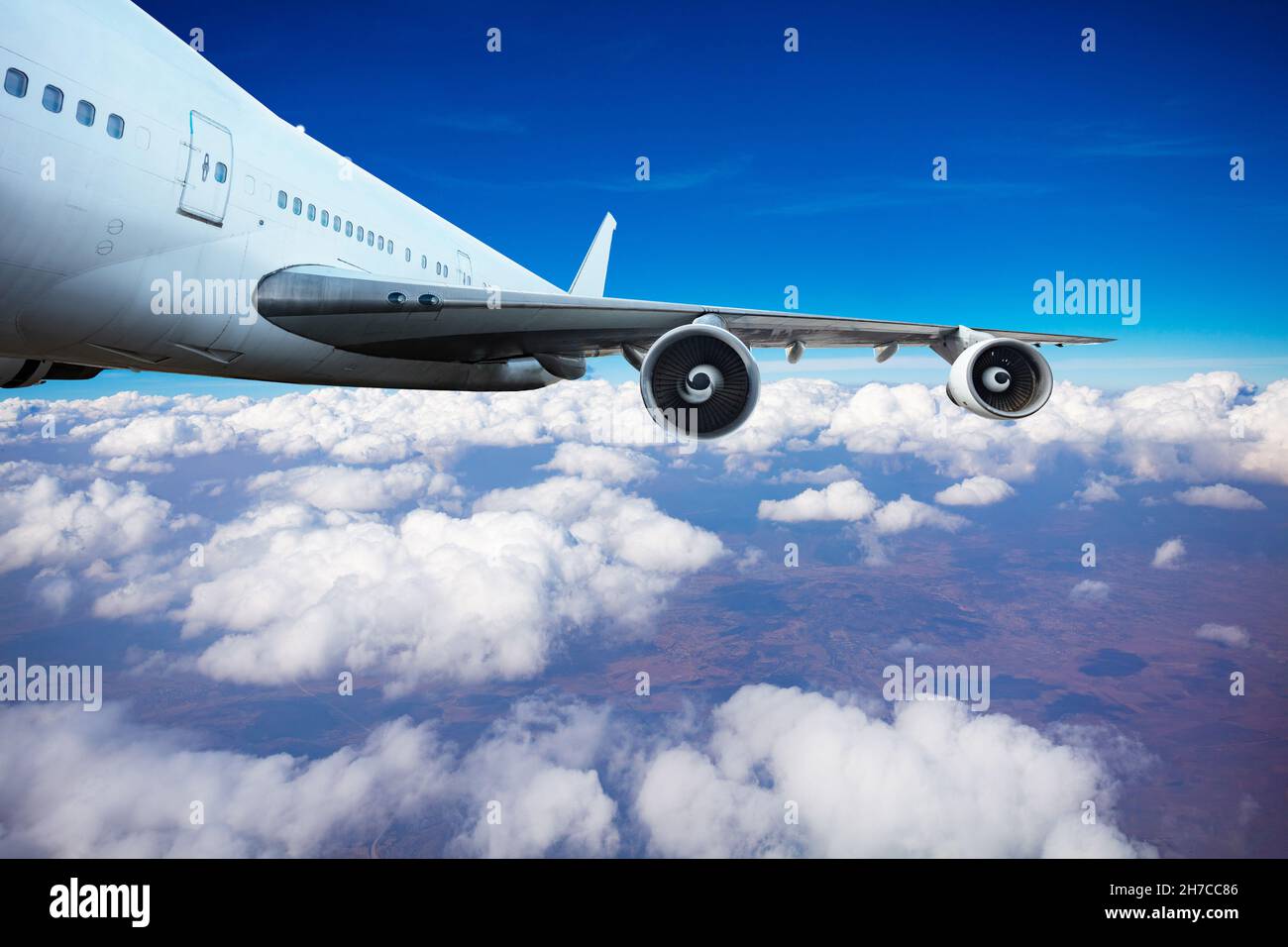 Jet engines and wing crop of plane fly in the sky Stock Photo - Alamy
