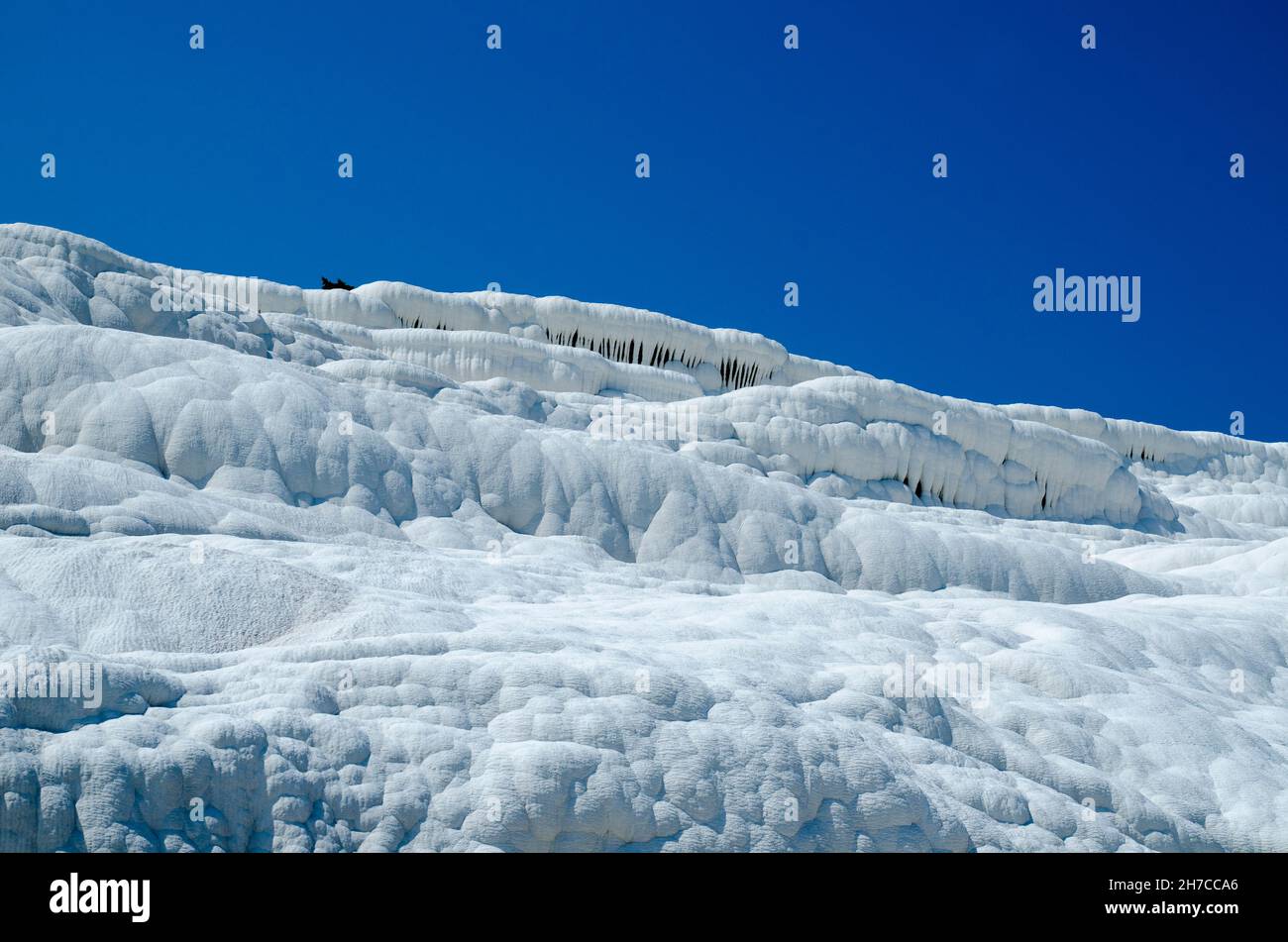White descending hills of Pamukkale, Turkey. Snow white mountains Stock ...