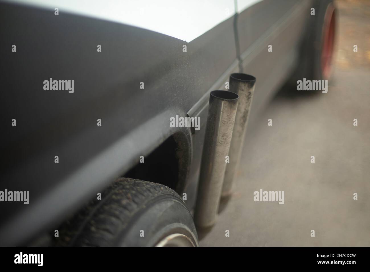 The race car is in the details. Machine with muffler pipes outside ...