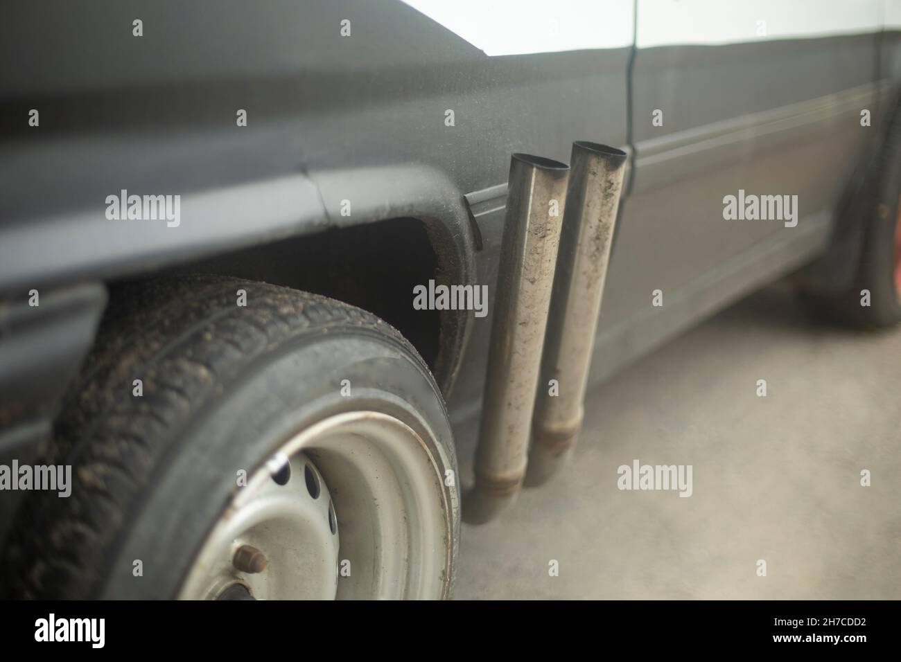 The race car is in the details. Machine with muffler pipes outside ...