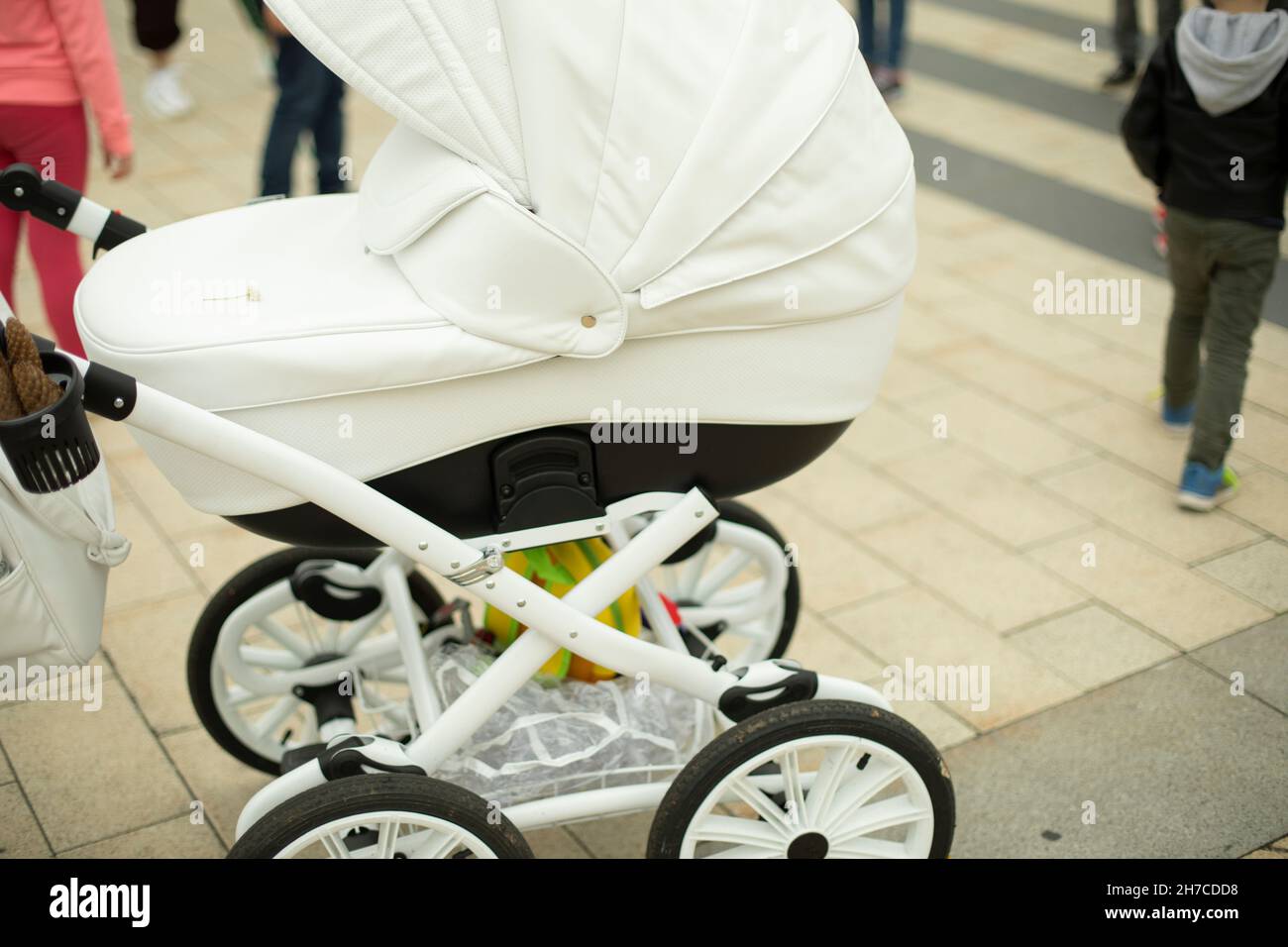 Children's stroller for walks. White cart for rolling the child ...