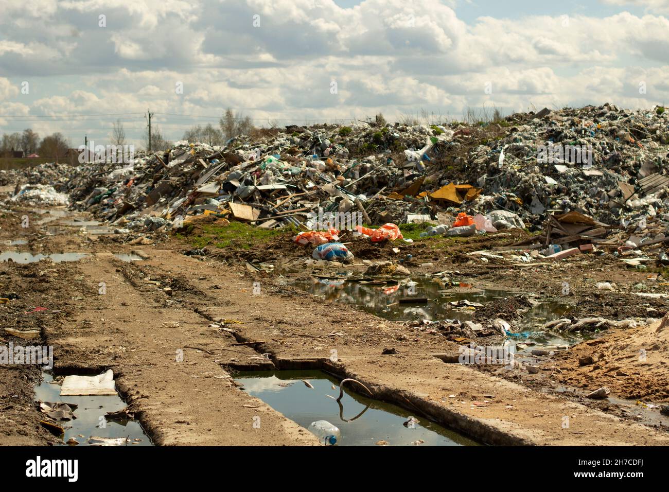 Garbage dump. Illegal dump in Russia. Garbage and writing waste. Harm ...