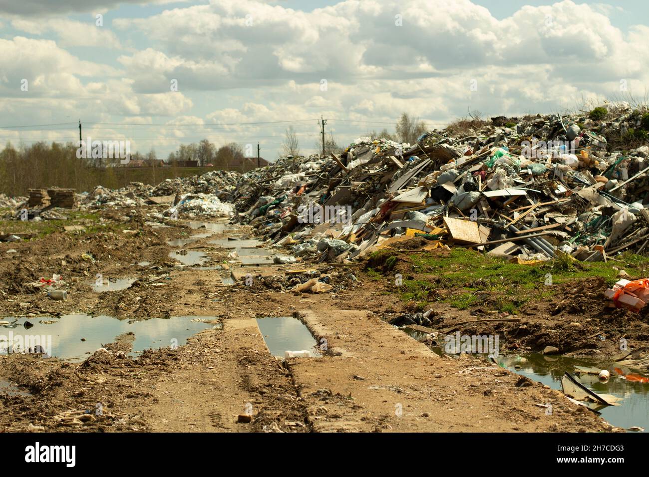 Garbage dump. Illegal dump in Russia. Garbage and writing waste. Harm ...