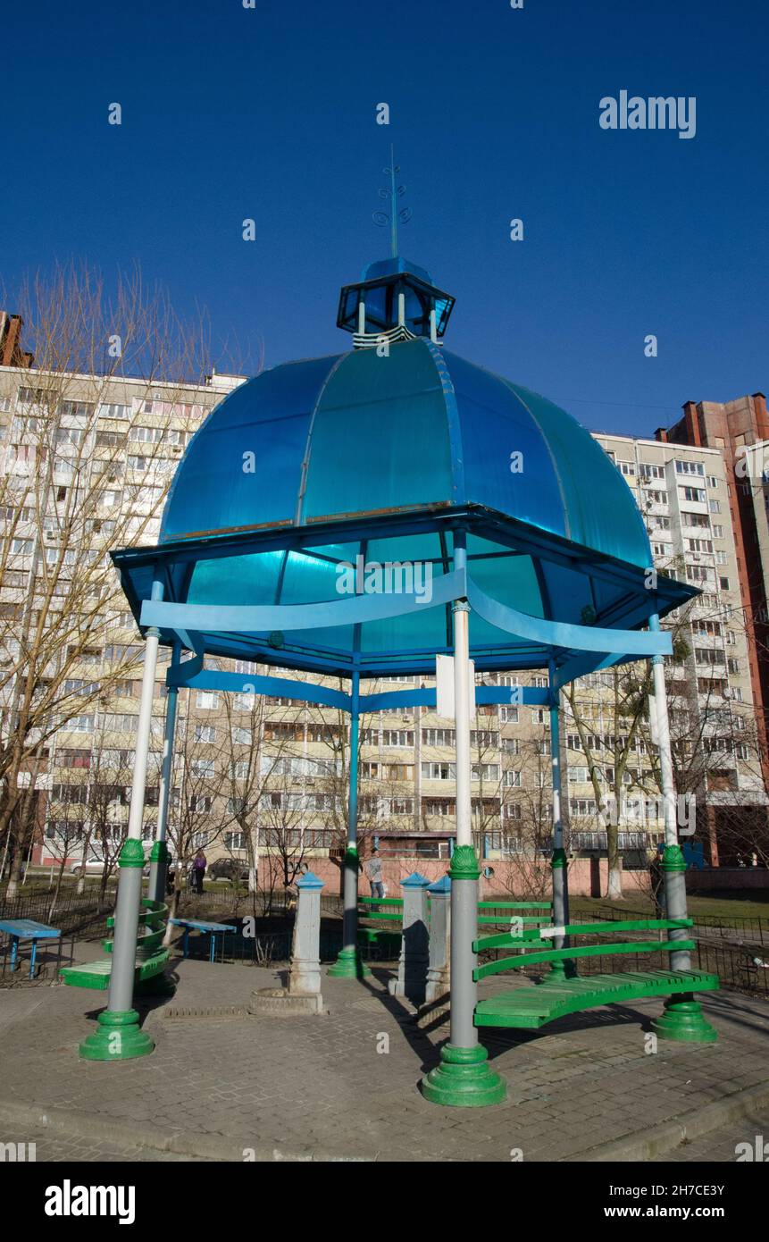 Blue rotunda arch with modern apartment buildings around Stock Photo ...