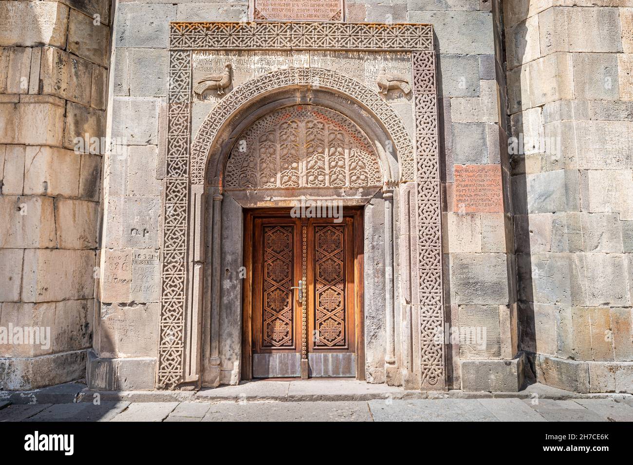 entrance portal to the church and monastery of Geghard in Armenia with ...