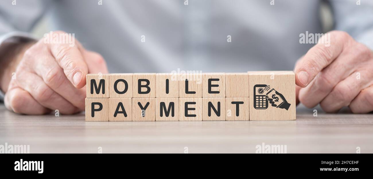 Wooden blocks with symbol of mobile payment concept Stock Photo - Alamy