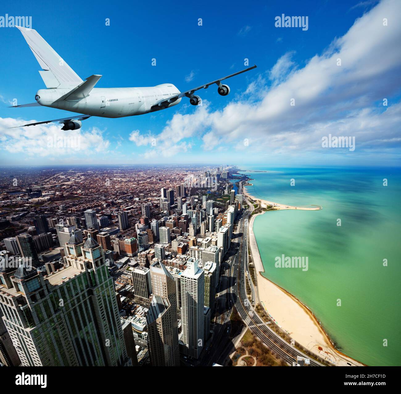 Tail view of jet airplane mid air in Chicago city Stock Photo - Alamy