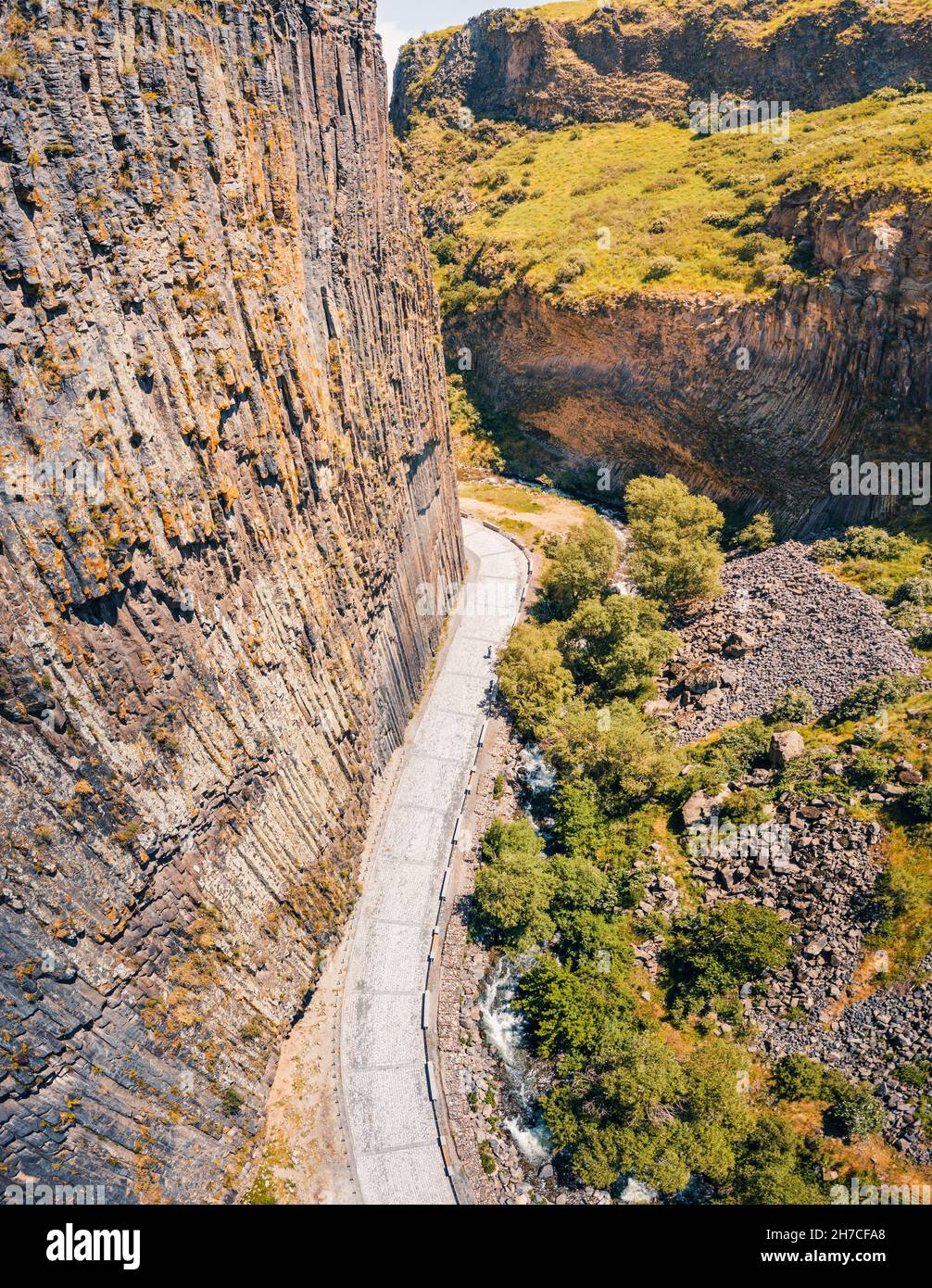 Car road and a pedestrian path leading to majestic gorge of Azat river ...