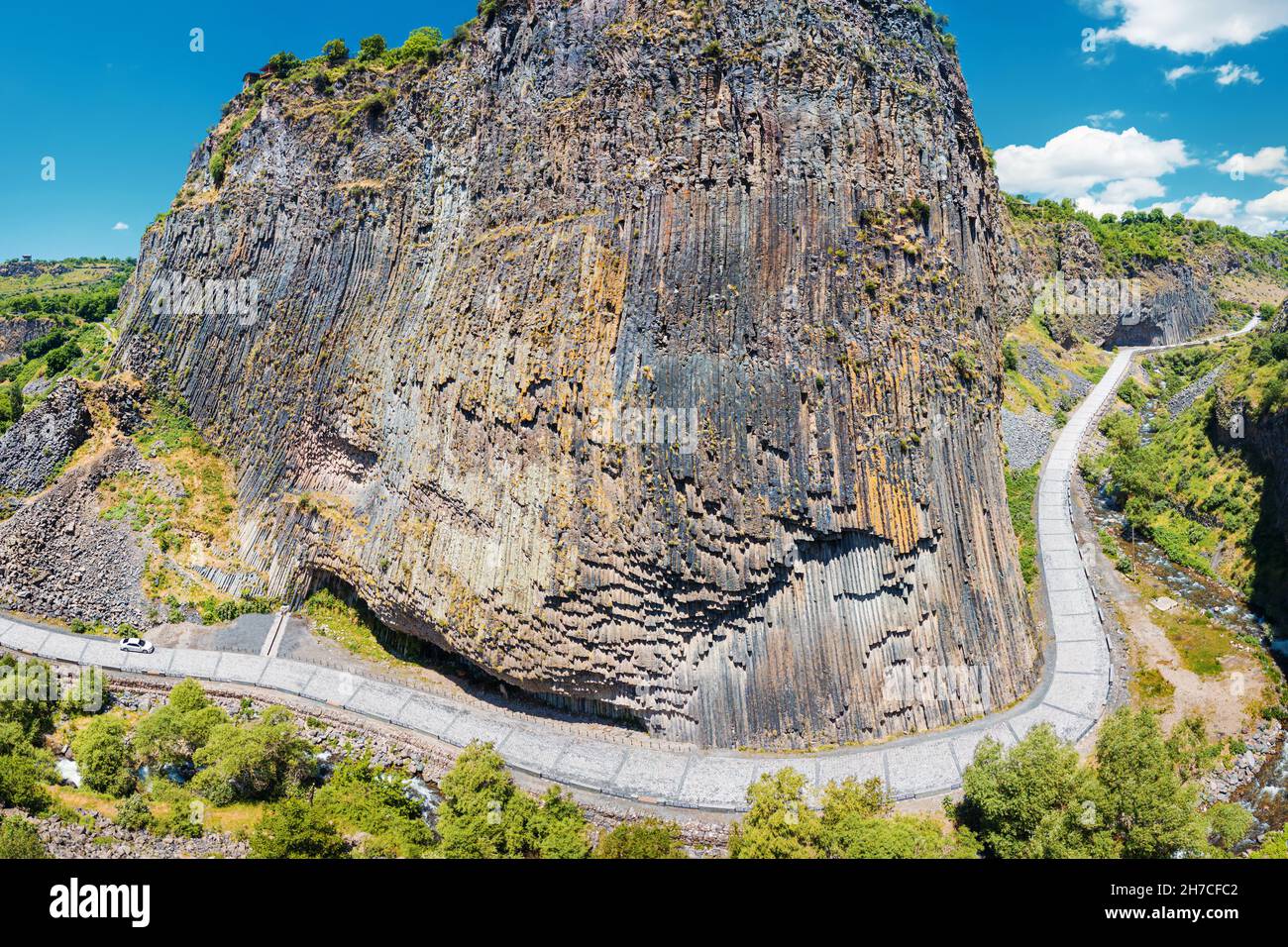 Car road and a pedestrian path leading to majestic gorge of Azat river ...