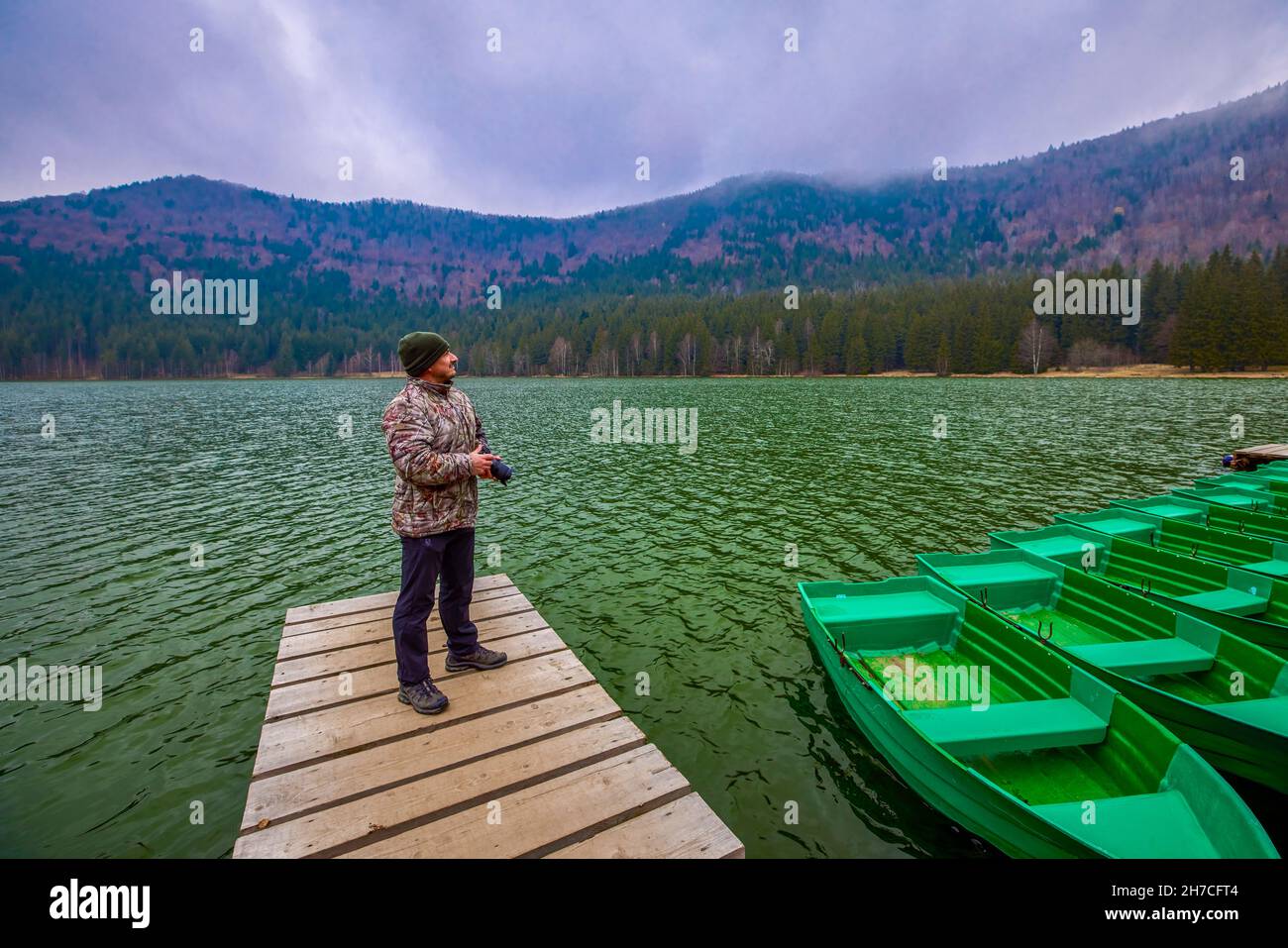 Tourist taking pictures of the landscape with St. Anne's Lake, Lake in ...
