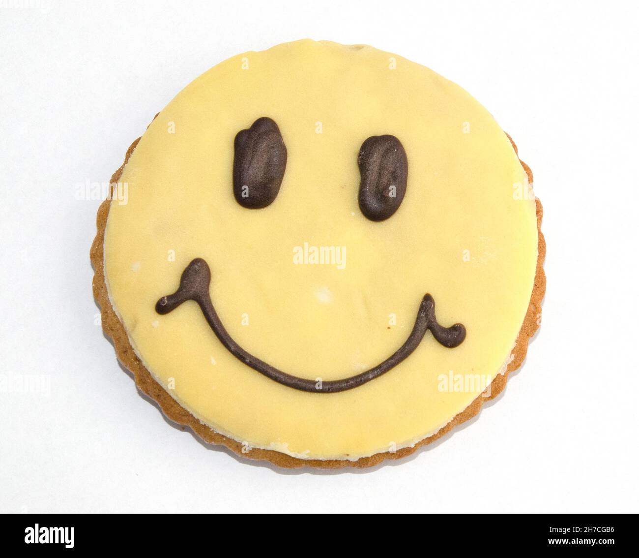 Funny smile cookie isolated over white background Stock Photo - Alamy