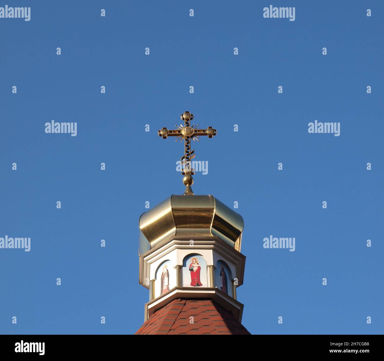 Golden orthodox church cross with icons on a blue gradient sky background Stock Photo - Alamy