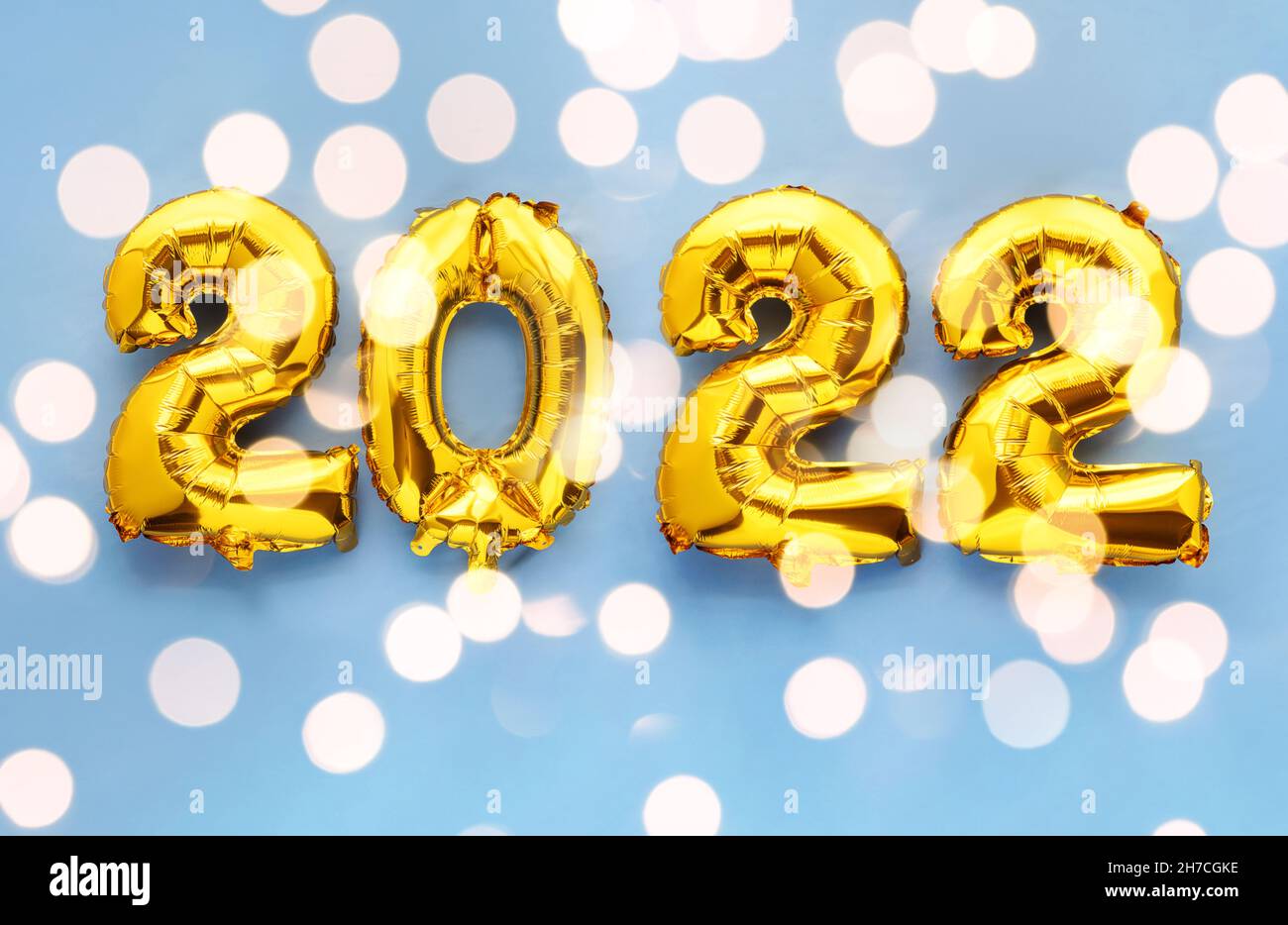 2022 new year foil balloon numbers on sparkling blue background Stock ...
