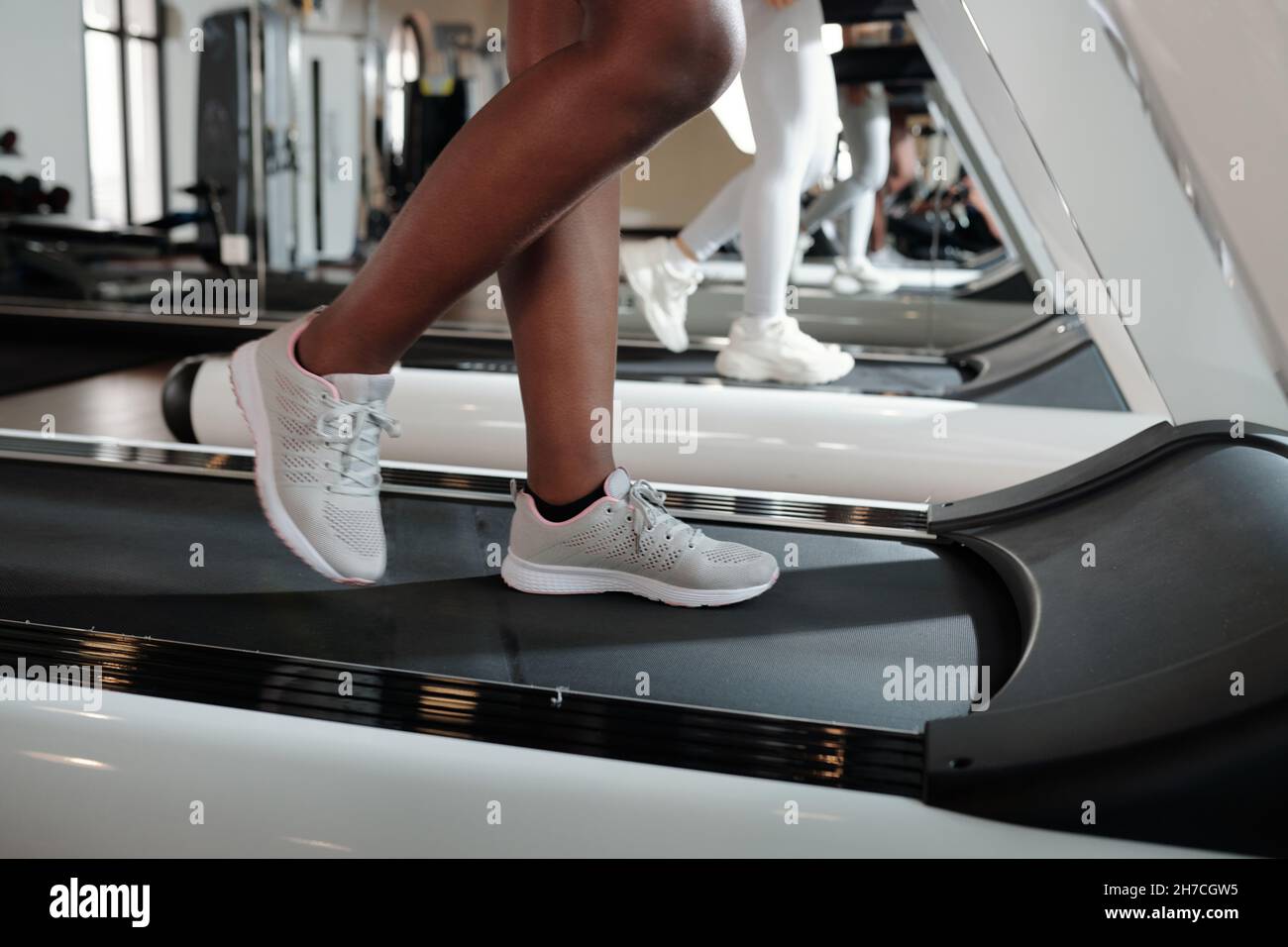 Female muscular legs on treadmill hi-res stock photography and images ...