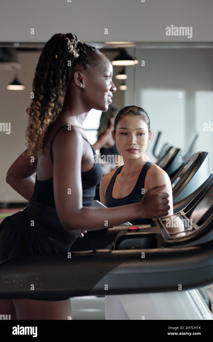 Smiling female fitness trainer hi-res stock photography and images - Alamy