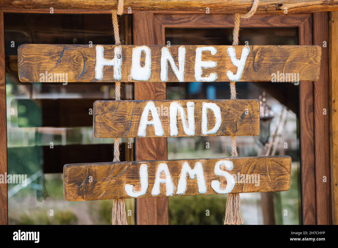 Honey and jams signboard on a honey shop entrance. Beekeeping business ...
