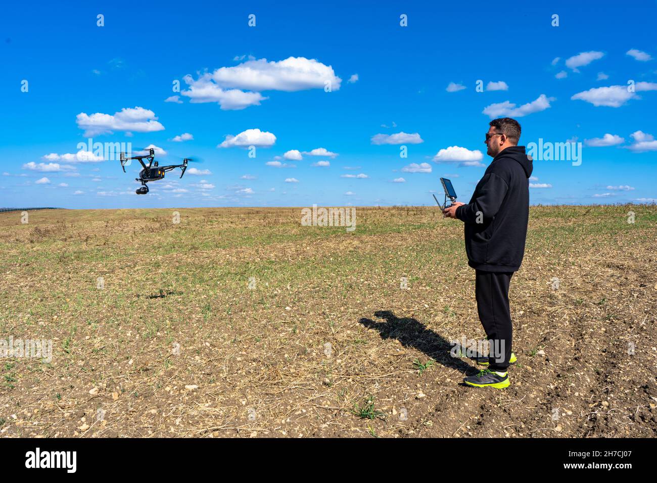 The pilot controls a professional drone Stock Photo - Alamy