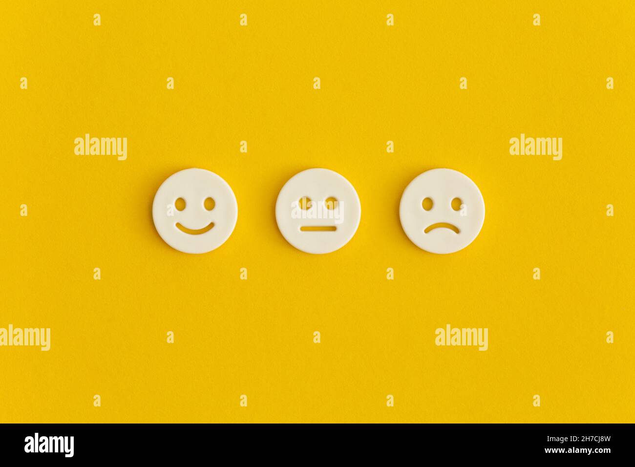 Emoticon smile on a yellow background. Customer feedback Stock Photo ...