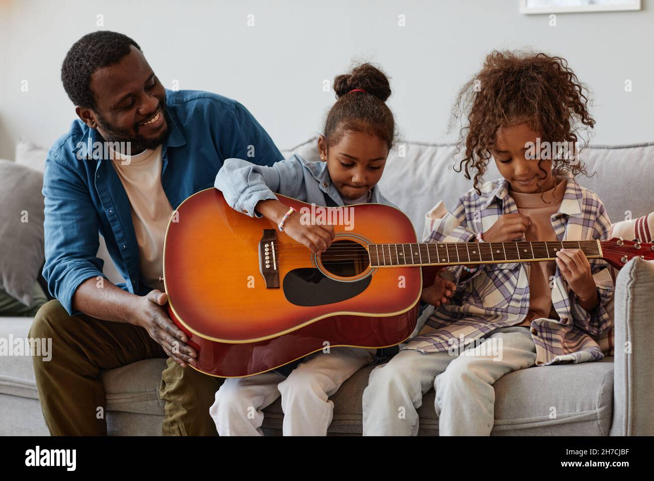 African children playing instrument hi-res stock photography and images ...